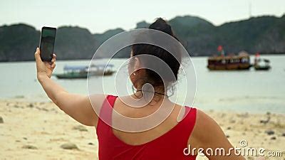 The Woman On The Beach Of The Small Tropical Island Delavt A Selfie On
