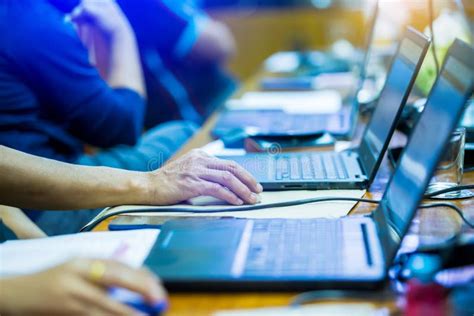 Selective And Soft Focus To Hand Hold A Mouse With Black Computer Notebook Working Team Watch