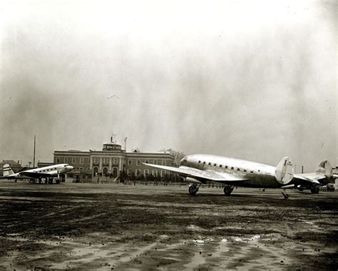 Curtiss Wright Model 20 Airplane Parked In Front Of Passenger Terminal