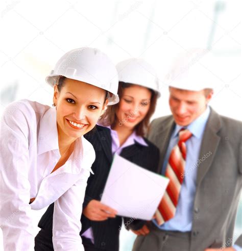 A Group Of Architects Discussing The Plans For A New Building Stock Photo Depositedhar