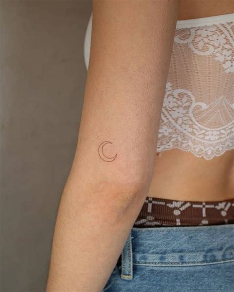 Fine Line Style Crescent Moon Tattoo Located On The Crescent Moon