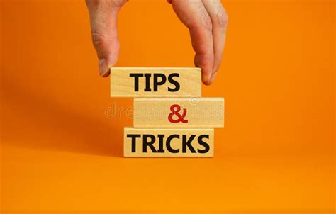 Tips And Tricks Symbol Wooden Blocks With Words `tips And Tricks` Beautiful Orange Background
