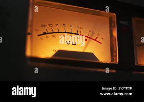 Detailed Close Up Of A Glowing Analog Vu Meter Emphasizing Warm Tones And A Nostalgic Aesthetic