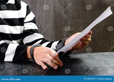 Unidentified Prisoner In Handcuffs In Prison Stripped Uniform Si Stock