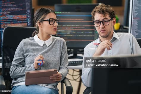 Software Programmers Analyzing Html Code And Database Brainstorming Script Ideas To Develop New