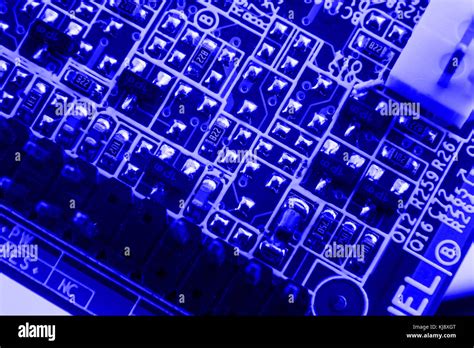 Electronics Components On Modern Pc Computer Motherboard Blue Background Close Macro Isolate