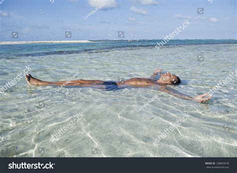 Man Floating Water On Beach Stock Photo Shutterstock