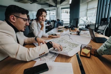 Business Team Analyzing Urban Development Project At Modern Office Stock Image Image Of
