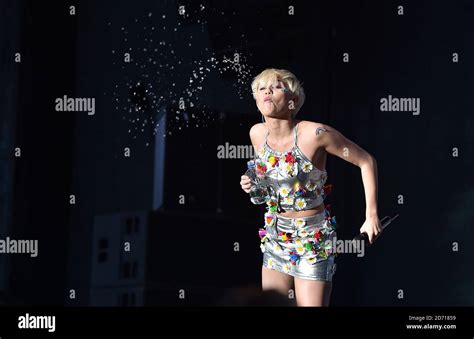 Miley Cyrus Spits Water Into The Crowd As She Performs During Capital