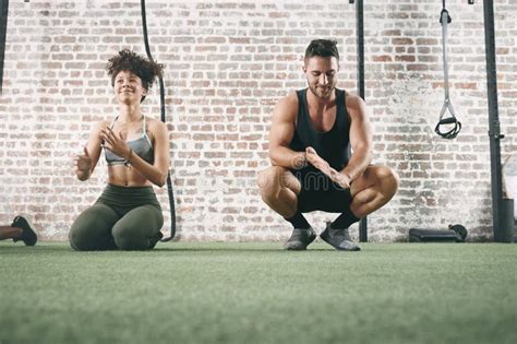 Dust Yourself Off And Try Again Two Sporty Young People Dusting Off