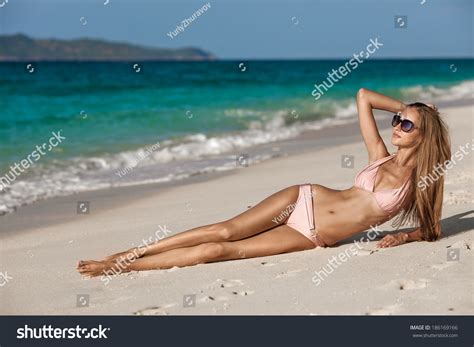 Women Tanning At The Beach