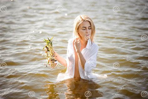 Nude Portrait Of Pretty Blond Girl In White Wet Shirt Stock Image