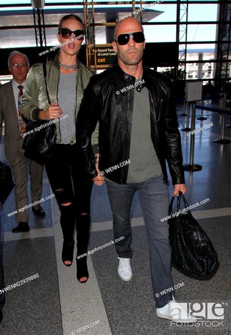 Rosie Huntington Whiteley And Jason Statham Depart From Los Angeles