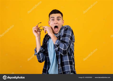 Horrified Young Guy Yelling In Panic Taking Off His Glasses Over