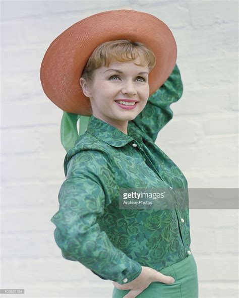 Actress Debbie Reynolds Pictured Smiling While Posing In A Green Debbie Reynolds Carrie