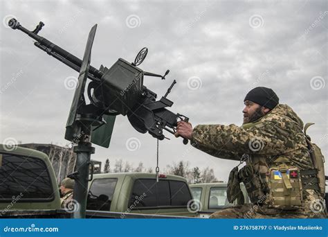 Member Of The Mobile Air Defence Group Checks A Dshk Machine Gun Atop Of A Pick Up Truck In The
