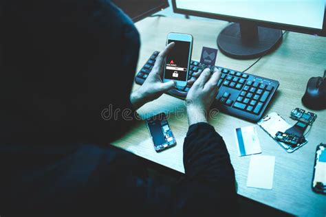 Male Hacker Is Trying To Access The Phone Security And Protection Of Personal Data Stock Image