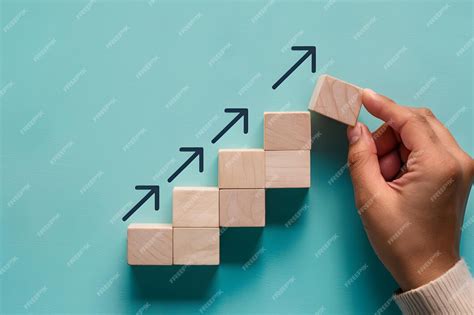 Premium Photo Wooden Blocks Forming Upward Stairs Hand Adding New