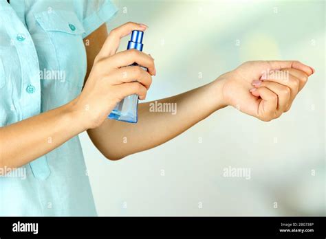 Woman Testing Perfume On Natural Background Stock Photo Alamy