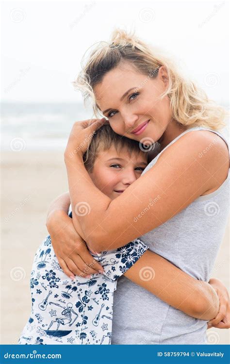 Happy Smiling Mother And Son On The Beach Stock Photo Image Of