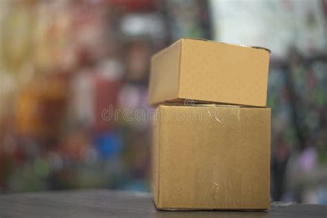 Two Parcel Crates Waiting To Be Shipped From The Online Sales And