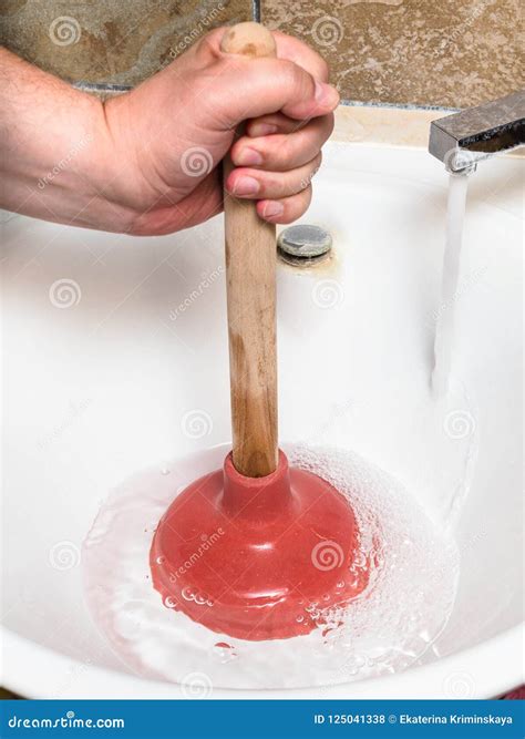 Plumber Clears Blockage In Sink Drain By Plunger Stock Photo Image Of Drain Hand