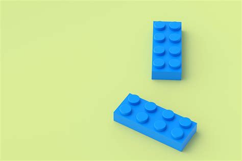 노란색 배경에 파란색 플라스틱 장난감 블록 개발 자식용 직사각형 형상 생성자입니다 유치원 에서 교육을위한 벽돌 생성자 부품입니다 공간을 복사합니다 3d 렌더링 개발에 대한