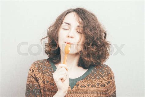 Girl Eats With A Fork Stock Image Colourbox