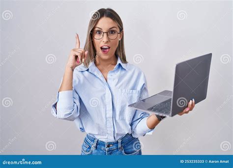 Young Woman Working Using Computer Laptop Pointing Finger Up With