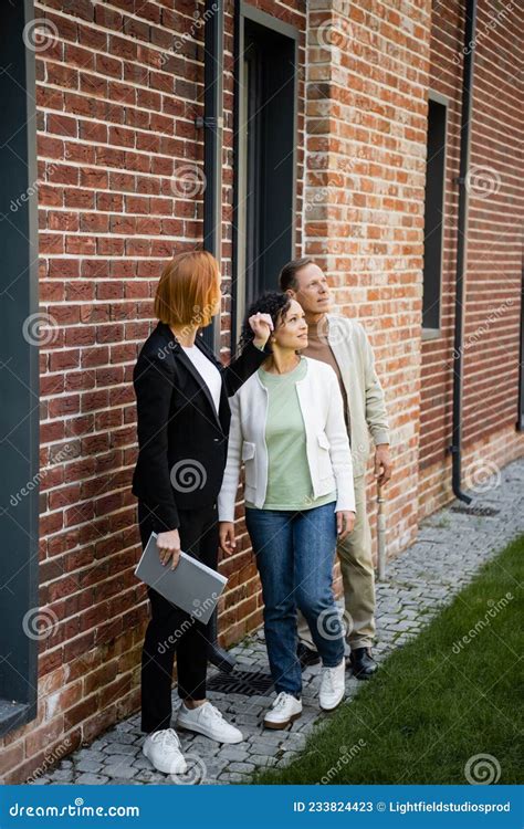 Full Length Of Redhead Realtor Holding Stock Image Image Of Family Brunette 233824423