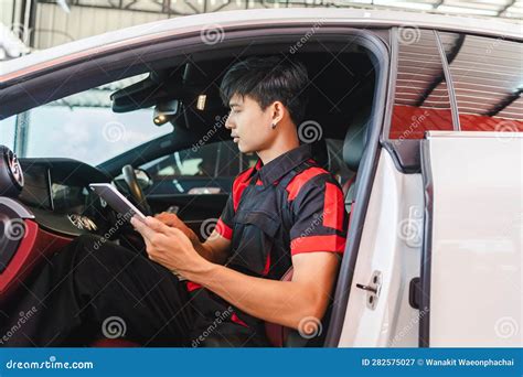 Auto Mechanic Performs Car Diagnostics Wirelessly Scan For Errors And Find Breakdowns Using A