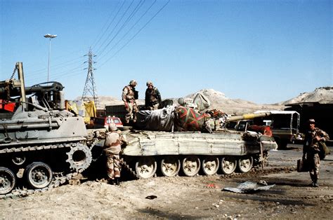 American Servicemen Prepare To Use An M 88a1 Armored Recovery Vehicle