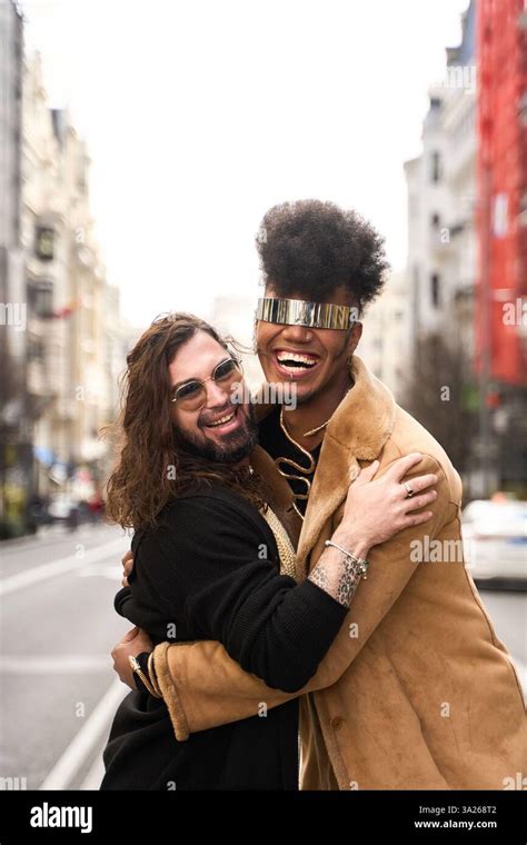 Two Androgynous Non Binary People Hugging Each Other Sharing A Moment