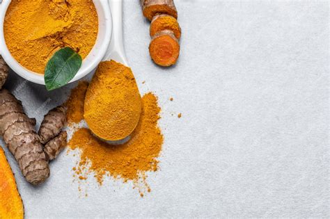 Premium Photo Closeup Turmeric Curcumin Powder In Spoon And Fresh