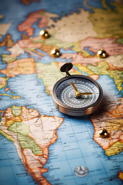 Classic Round Compass On Background Of Old Vintage Map Of World As