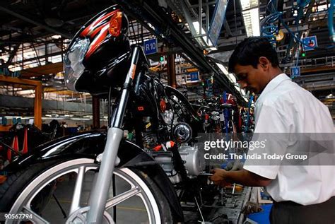 Employees Working At Assembly Line Of Bajaj Motorcycle In The Bajaj
