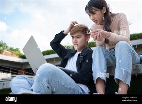 Asian Babes Sitting On Step Are Excited And Stressed And Disappointed After Check Exam