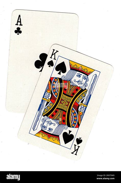 A Blackjack Hand Of Playing Cards Showing An Ace And King On A White