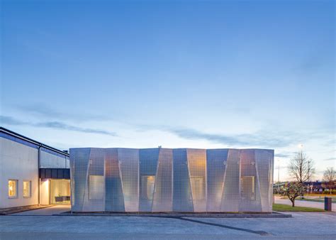 Perforated Metal Covers The Facade Of This Office Extension