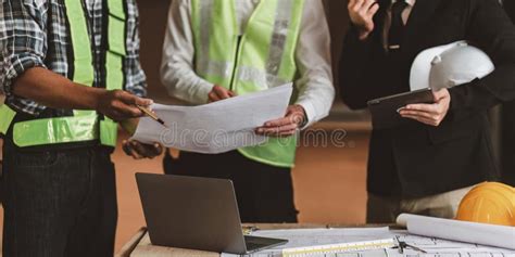 Architect Team Working With Blueprints For Architectural Plan Engineer