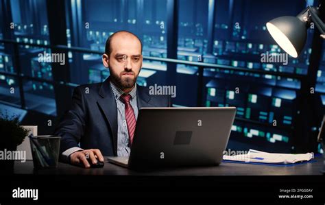 Server Technician Specialist Working On Laptop Running Networking Diagnostics On Cyber Security