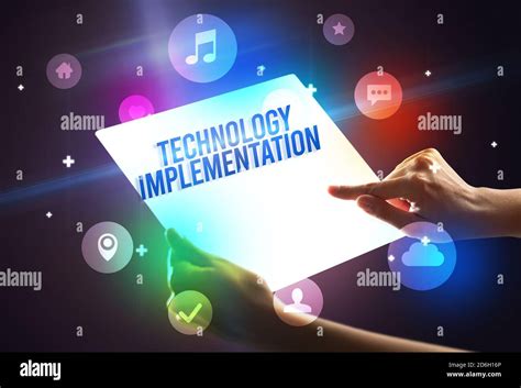 Holding Futuristic Tablet With Technology Implementation Inscription