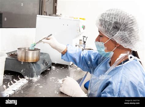 Scientist Embedding Tissues In Paraffin Blocks For Sectioning