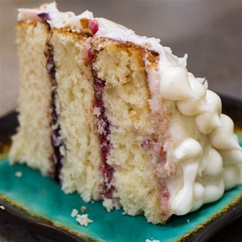 Made From Scratch Yellow Cake Filled With Raspberry Filling And Frosted