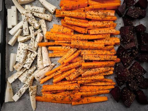 Parsnip Carrot And Beetroot Batons Seasoned And Ready For Roasting