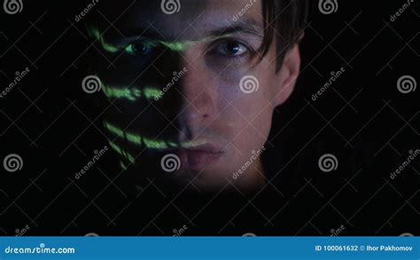 Man Programmer Hacker Working On A Computer While Green Code Characters