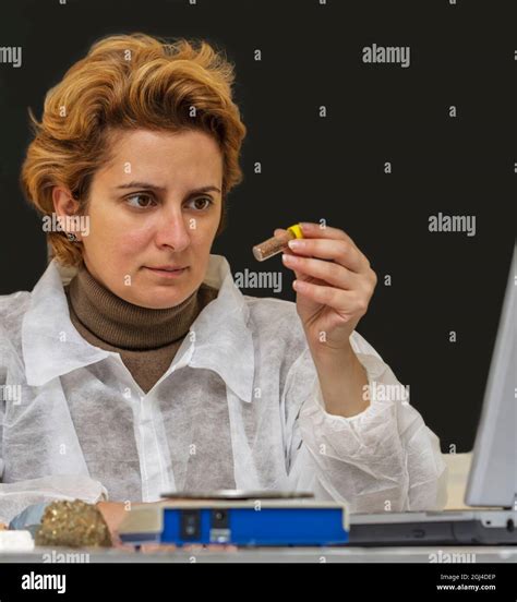 Female Geologist Researcher Analysing A Rock At Her Workplace Stock Photo Alamy