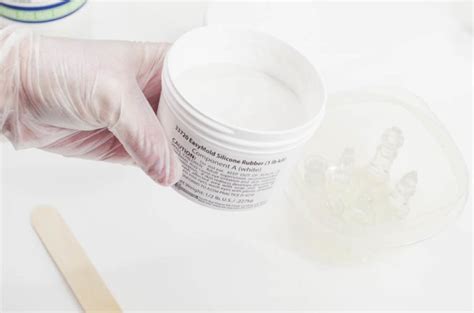 DIY Resin Chess Pieces Mixing Silicone Rubber Pour Part A Into A Large Disposable Mixing