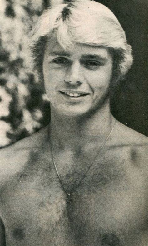 An Old Black And White Photo Of A Shirtless Man