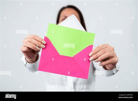 Female Professional Holding Envelope And Letter In Hands With Important